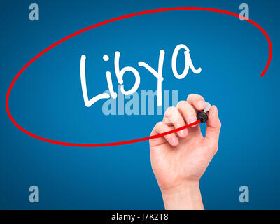 Man Hand writing Libya with black marker on visual screen. Isolated on ...