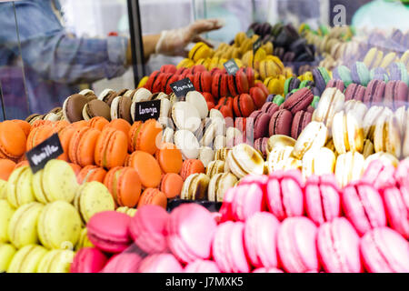 Colorful macarons dessert with a signs saying: Orange and vanilla Stock ...