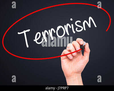 Man Hand writing Terrorism with black marker on visual screen. Isolated ...