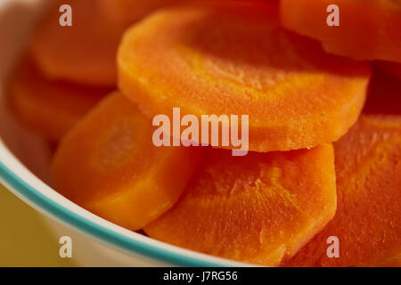 poached sliced carrots, sometimes called carrot coins Stock Photo - Alamy