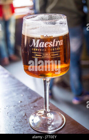 A printed glass of Mahou Spanish lager beer on a bar, Oviedo, Asturias ...