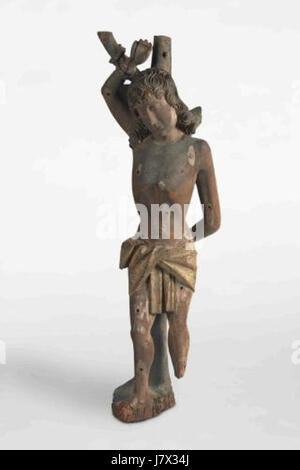 A religious depiction of St. Sebastian, shown in a loincloth, bound to ...