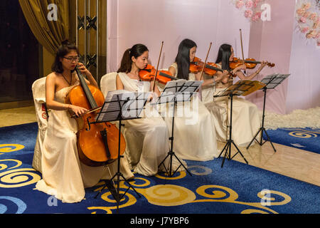 Women string quartet playing music during concert. November 12, 2013 ...