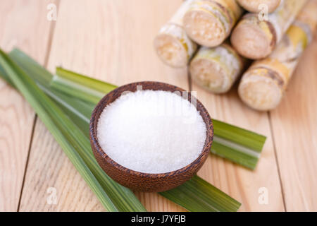 Sugar cane on wooden table background Stock Photo - Alamy