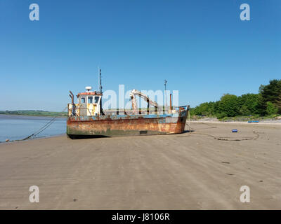 A fishing vessel, the Vicky Leigh, moored on the beach at Ferryside ...
