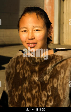 Inuit, girl in traditional dress, bench, Eskimo, Iceland, Canada Stock ...