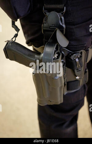 A Tactical Firearms officer from the City of London Police (left) and ...
