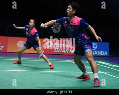 Chae Yoo-jung of South Korea returns a shot to Tang Chun Man and Ng Tsz ...