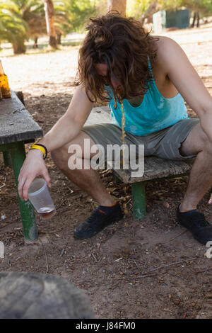 Drunken man vomiting Stock Photo - Alamy