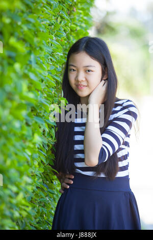 portrait of younger asian teen with happiness emotion and smiling face ...