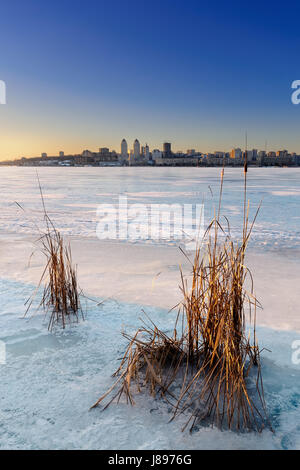 A tranquil winter sunset lake with reed flowers are in bloom. Bright ...
