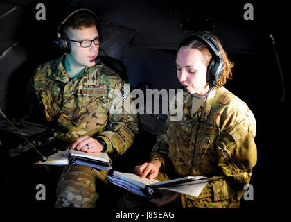 Members of the 25th Intelligence Squadron perform various tasks at ...
