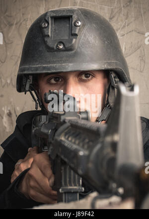 An Iraqi special operations forces soldier practices sweeping an area ...