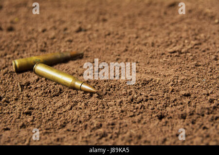 Pile of rifle bullets isolated on grey background. Top view Stock Photo ...