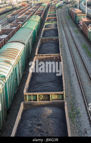 long trains with industrial goods stand on the rails Stock Photo - Alamy