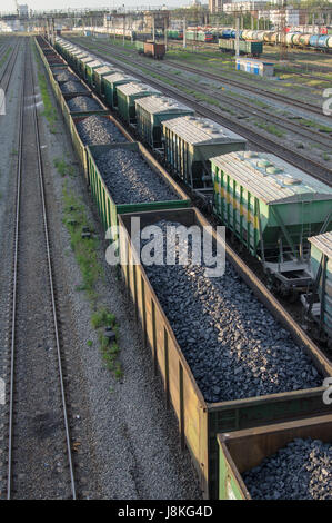 long trains with industrial goods stand on the rails Stock Photo - Alamy