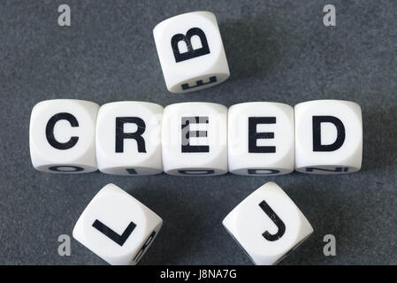 word creed on white toy cubes, business concept Stock Photo - Alamy