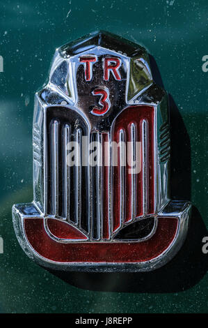 Triumph TR3 model badge in blue and white as fitted to a blue car Stock ...