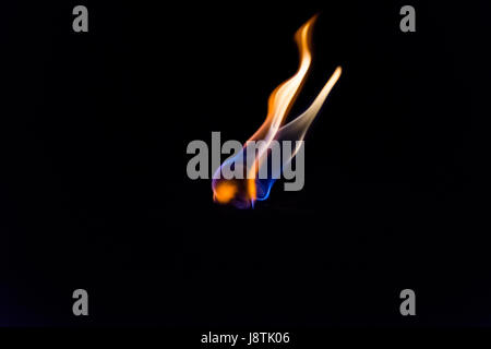 Fire with blue flame base and orange flames towards top with circular ...