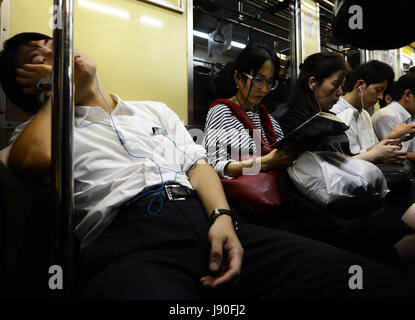 Japanese passengers sitting in metro, Tokyo, Japan Stock Photo - Alamy