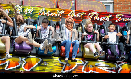 People riding on a Miami Trip ride at the fairground, UK Stock Photo ...
