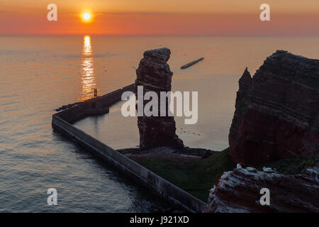Beautiful sunset at most western point of German island Helgoland near ...