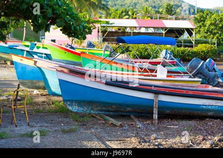 Colored small boats on Antilles sea, with blue sea Stock Photo - Alamy