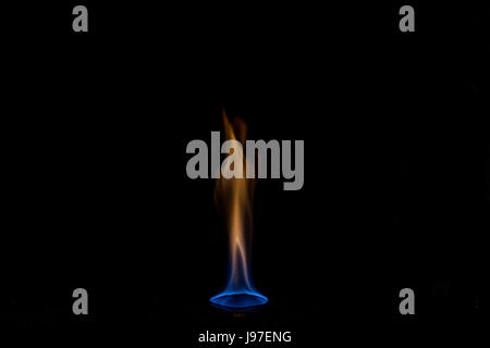 Fire with blue flamed base and orange flames towards top with circular ...