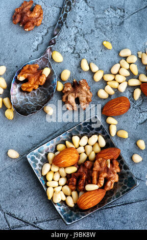 mix of nuts on the plate, stock photo Stock Photo - Alamy