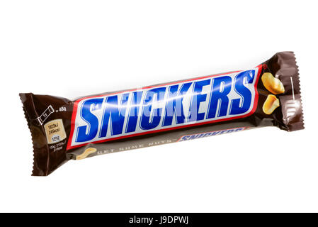 Snickers chocolate bar on white background with open cut up bar by the ...