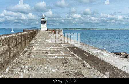 View of the lighthouse at the end of Holyhead breakwater on Anglesey ...