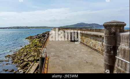 A view along the Holyhead breakwater on Anglesey towards Holyhead ...