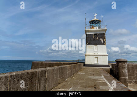 View of the lighthouse at the end of Holyhead breakwater on Anglesey ...