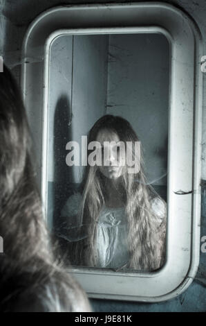 Dark room creepy with the reflection of a ghost in the mirror, room of ...
