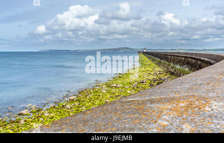 Perspective view along the breakwater at Holyhead on Anglesey Stock ...