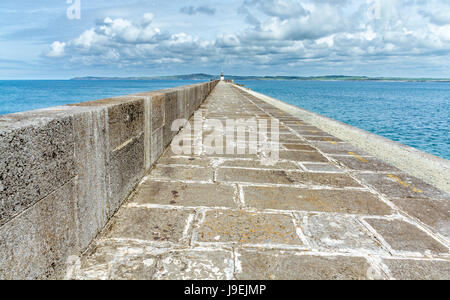 Perspective view along the breakwater at Holyhead on Anglesey Stock ...