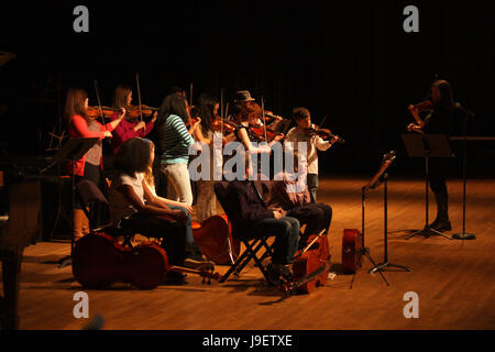 Students orchestra recital Stock Photo - Alamy