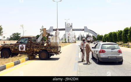 Tripoli, Libya. 1st June, 2017. Security force members stand guard at ...