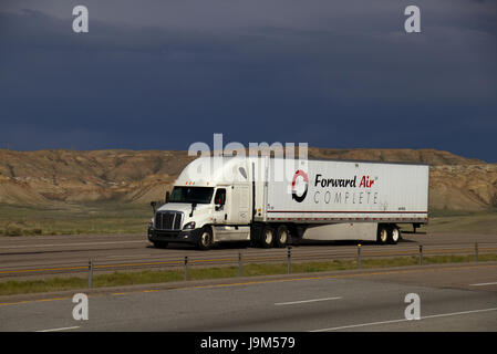 A White Freightliner Semi-Truck Pulls a White "Prime Inc." Trailer ...