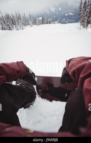 Skier Resting on Snowy Slope at Ski Resort Stock Photo - Alamy