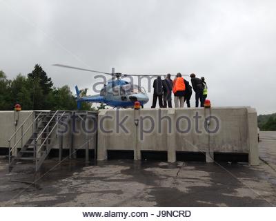 Concrete helicopter landing pad on the top of a building. Shapes of ...