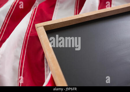 Close-up of American flag and slate on wooden table Stock Photo - Alamy
