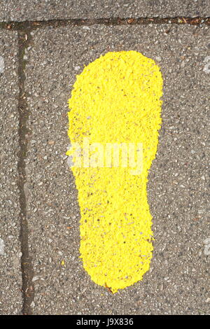 Yellow Street Mark Footprints Stock Photo - Alamy