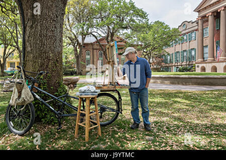Artist David Anthony Babb known as DAB works on a painting using his ...