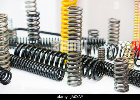 Multicolored metal of different sizes car springs Stock Photo - Alamy