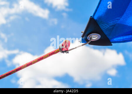 Awnings in sails shape over cloudy sky background Stock Photo - Alamy