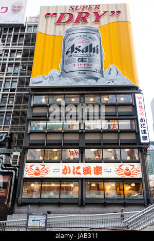 The famous neon Asahi beer sign, illuminated at night in Dotonbori ...