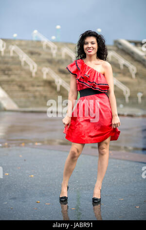 Woman in nice soaking wet dress look her reflection Stock Photo - Alamy