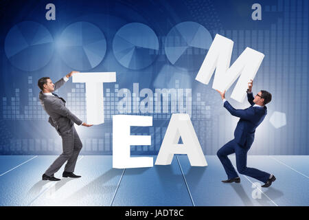 Teamwork concept with businessman putting letters Stock Photo - Alamy