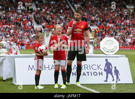 Michael Carrick speaks next to his children Jacey and Louise before his ...